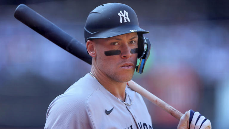 Aaron Judge gets struck in the face by a toss from Yankees teammate Anthony Volpe