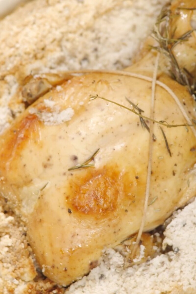 Juicy salt-crusted roasted chicken with herbs and brine