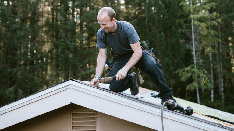 Here's Why You'll See People Put Tires On Their Roof Sometimes