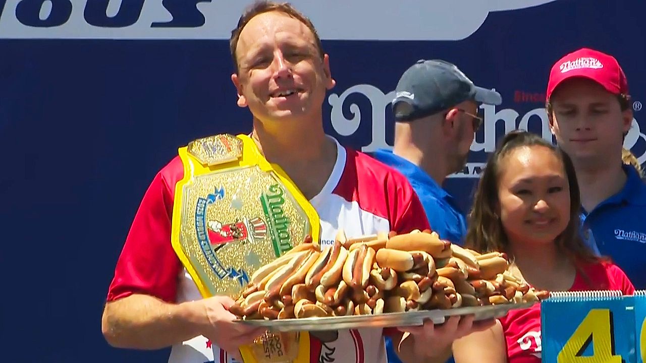 Joey Chestnut claims 17th title in triumphant return to Nathan's Hot ...
