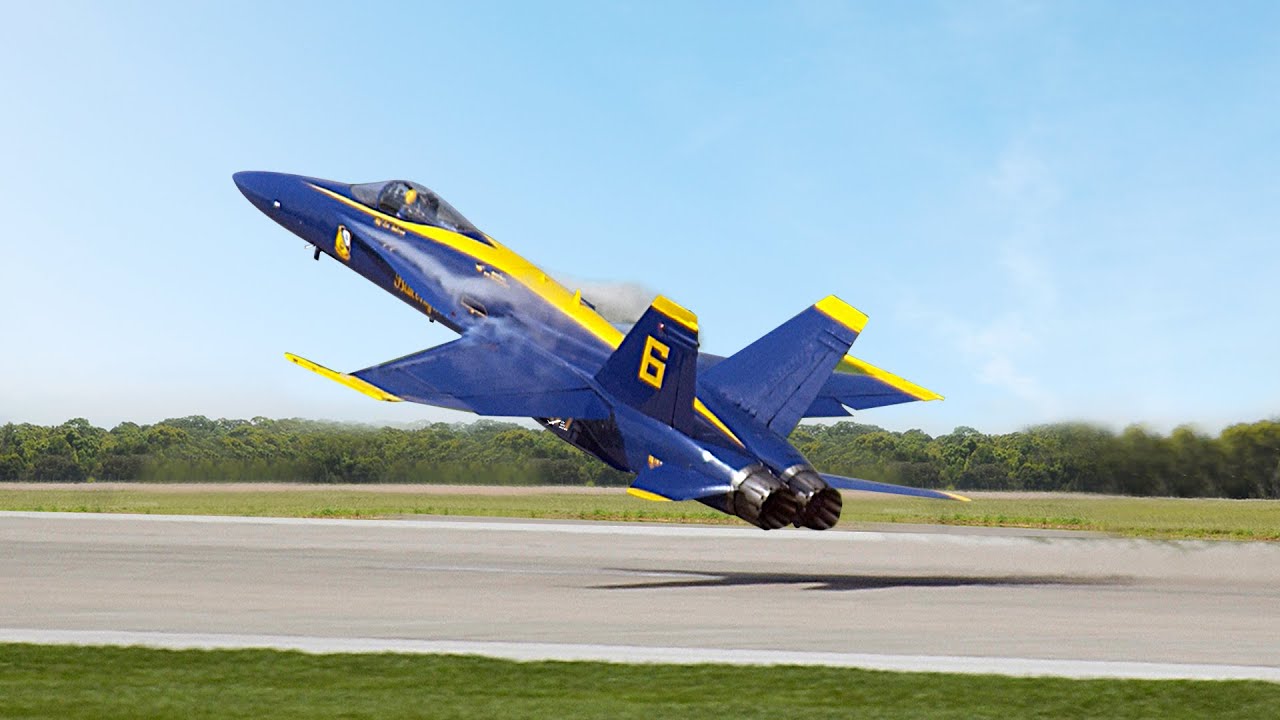 Blue Angels F/A-18s perform impressive low passes through the skies
