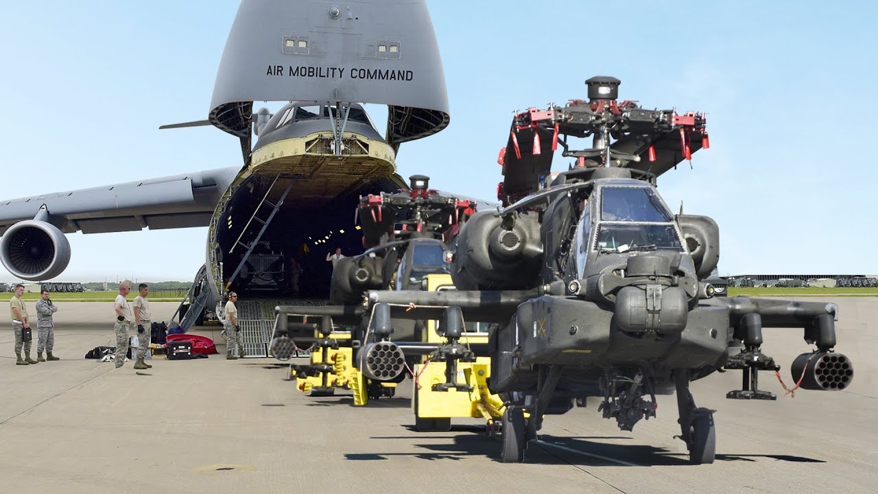 A fleet of helicopters is unloaded by a US mega plane