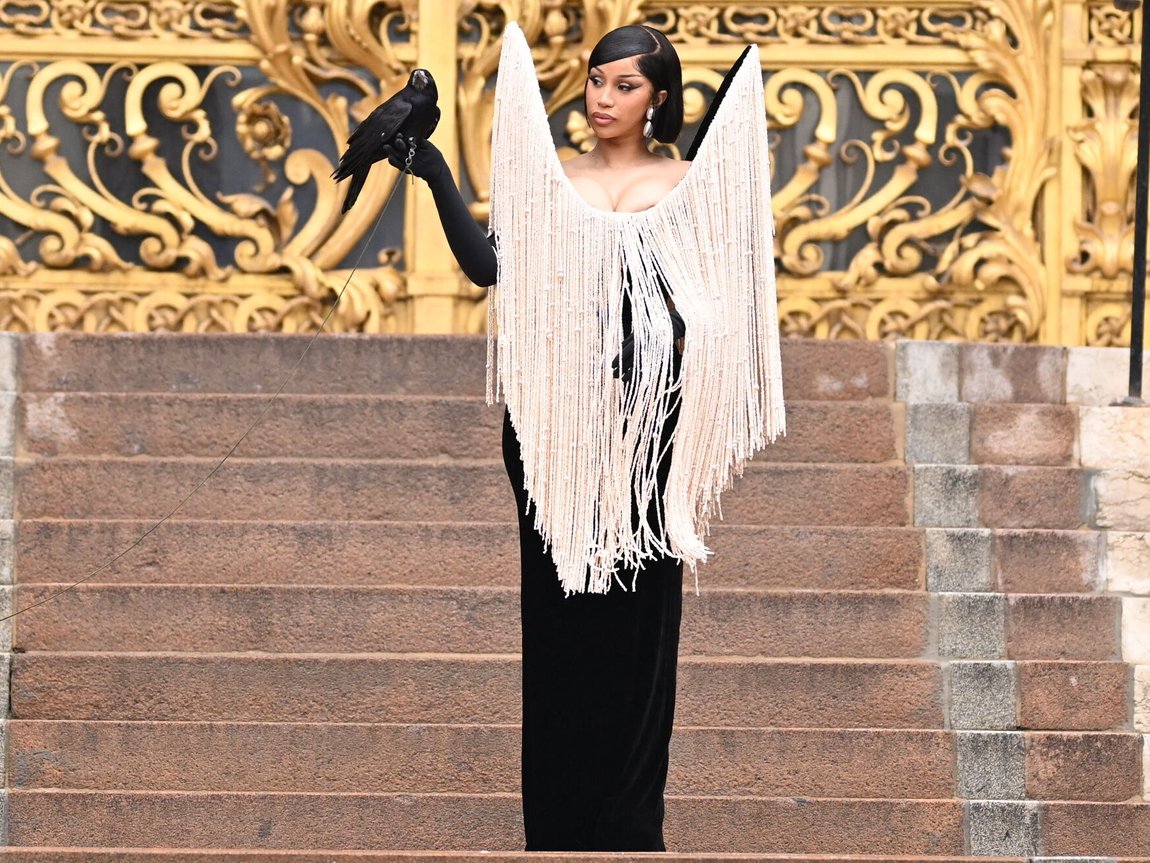 Paris Fashion Week: Cardi B Appears with Live Raven