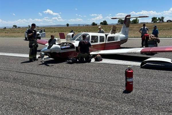 Single-engine plane lands without landing gear
