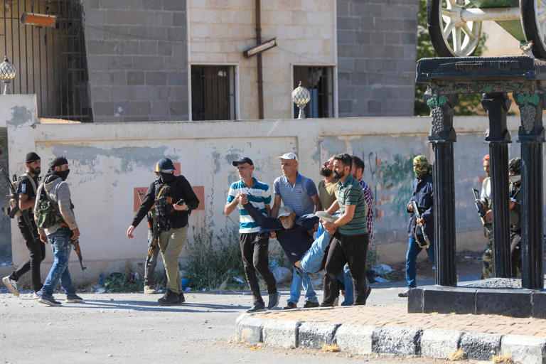 Syrian government says 18 troops killed responding to violence in Sweida