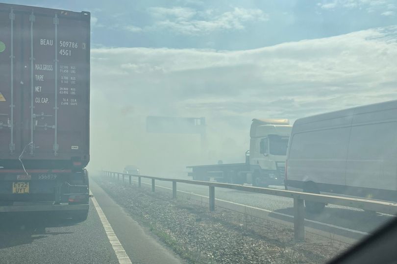 Five fire engines tackling large wildfire next to busy Cambs road