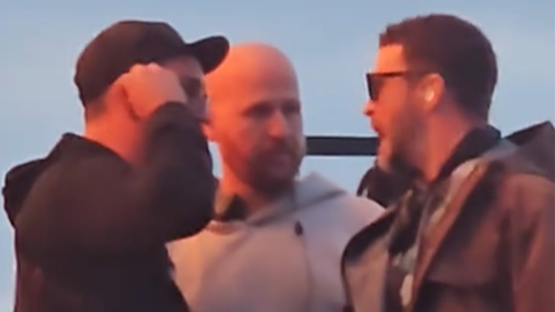 Justin Timberlake performing on stage in a blue jacket