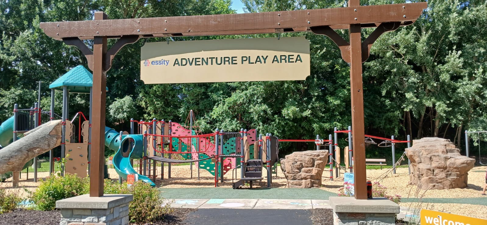 This Fox Crossing park features giant logs, a play train and a ...