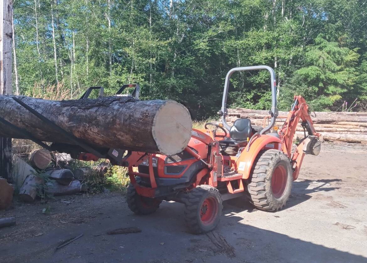 Stolen tractor recovered, two placed into custody