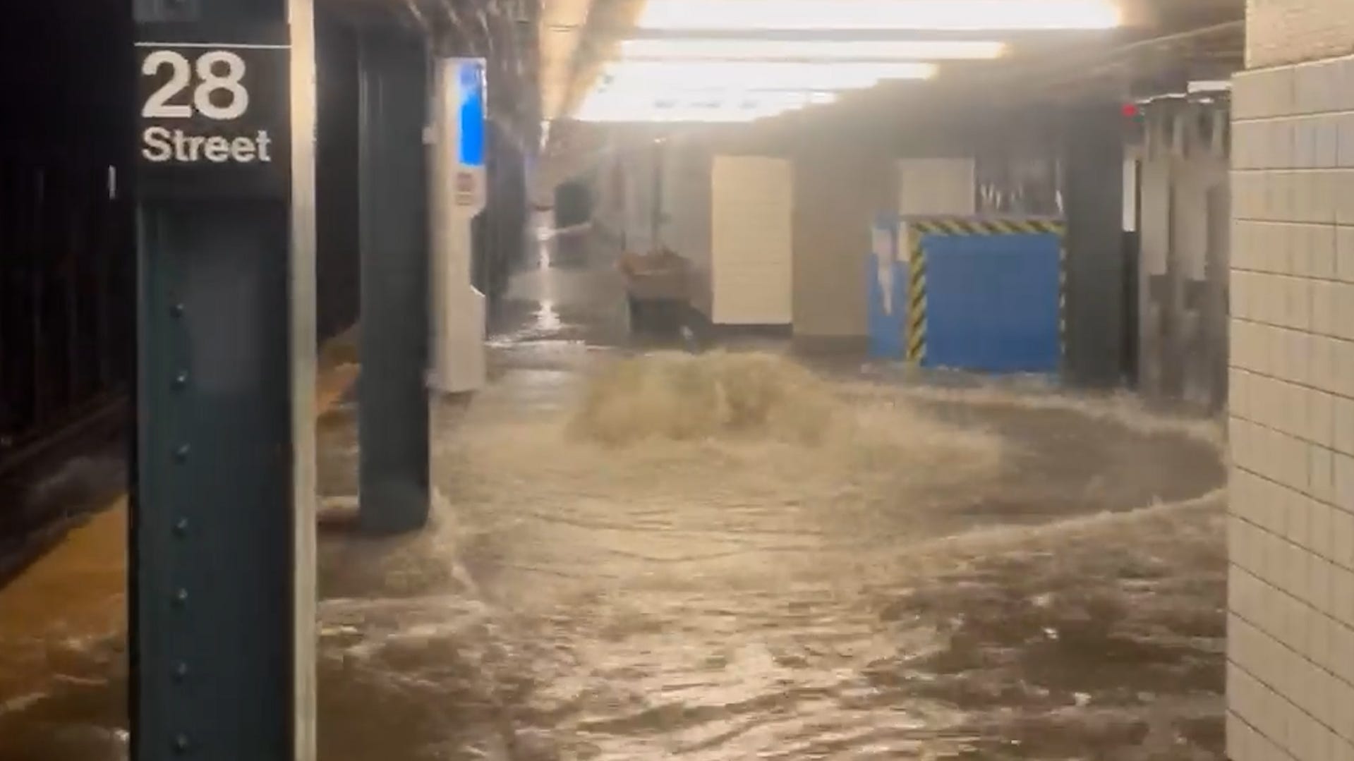 Floodwater gushes into several New York subway stations during heavy rain