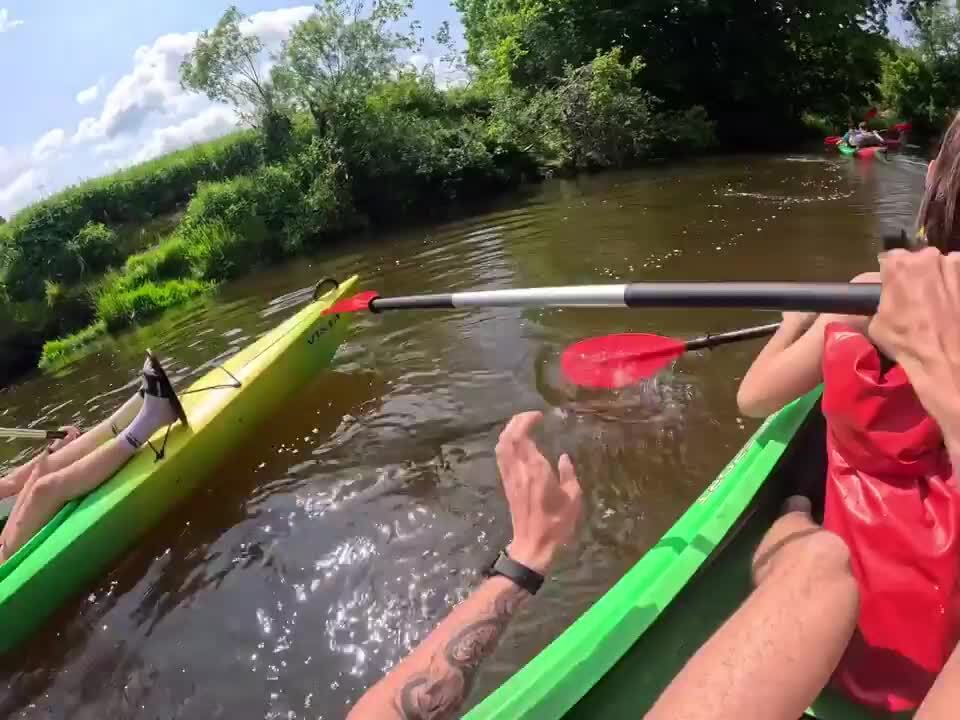 Man Nudges Passing Kayak With Paddle, Sending Riders Into Bushes