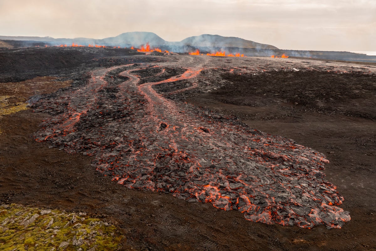 Tourists evacuated as Iceland volcano erupts opening up 1km-long fissure