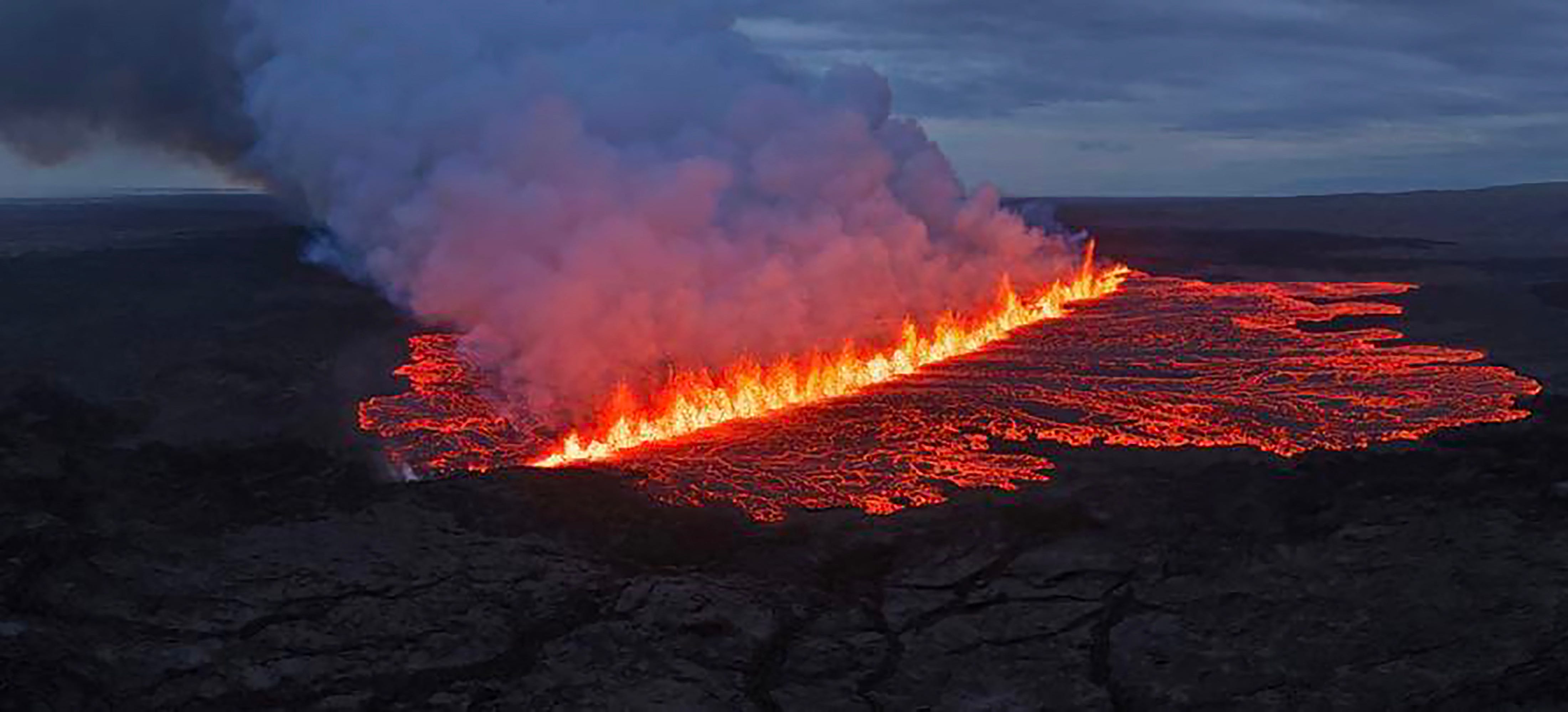 Iceland volcano eruption creates fiery scene of smoke and glowing lava