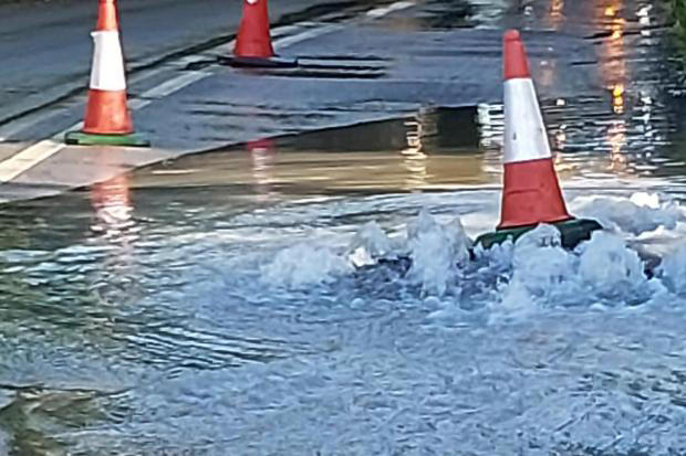 Water main burst flooding closes major Bucks A-road with severe traffic