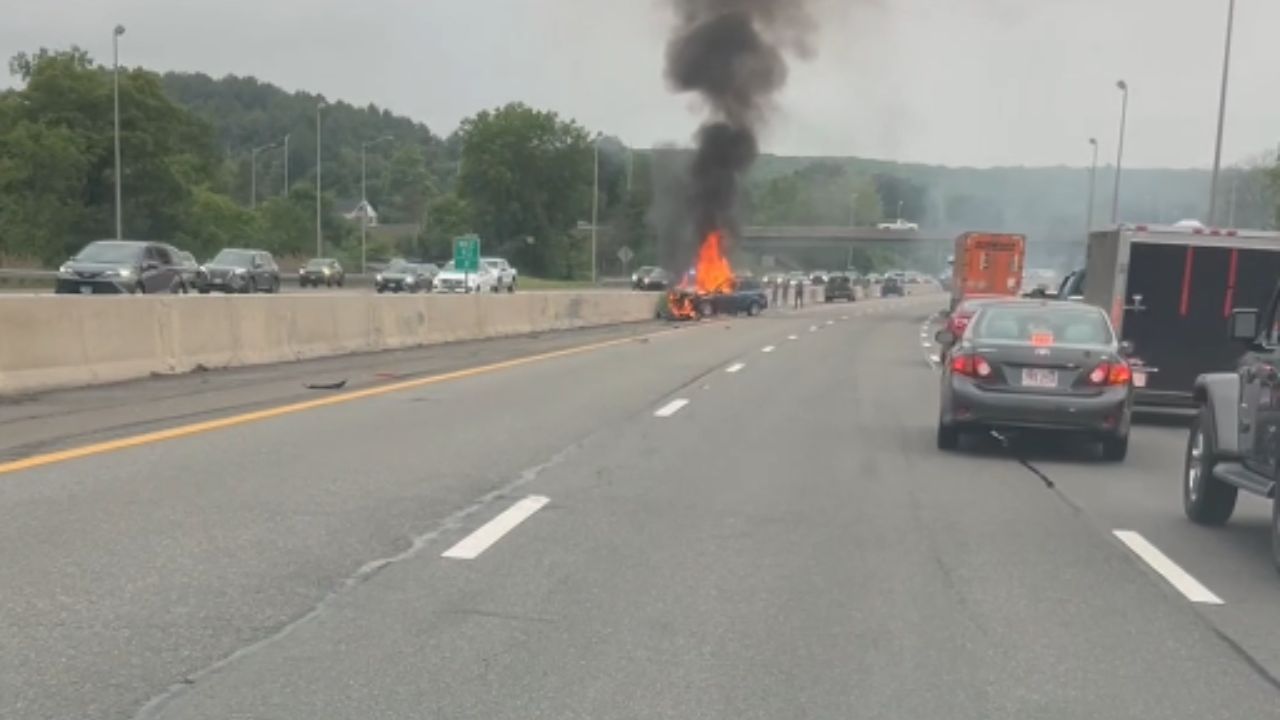 Woman captures startling footage of a car on fire on I-90 while traffic ...