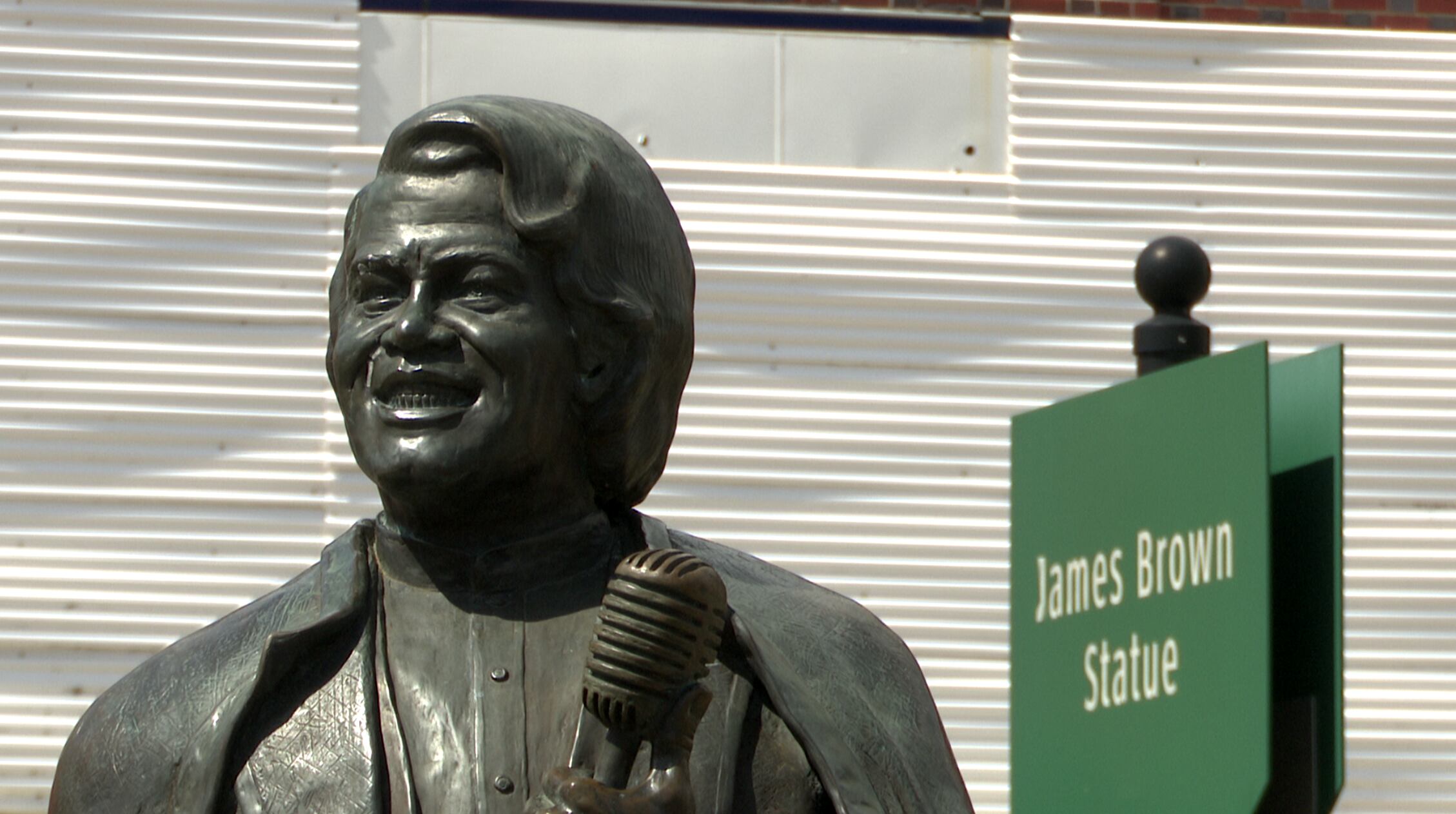 Well-wishers come out to see James Brown statue taken down