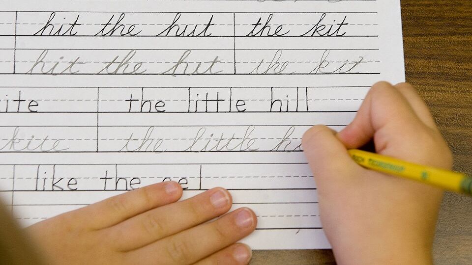 Local schools awarded for excellence in teaching cursive writing