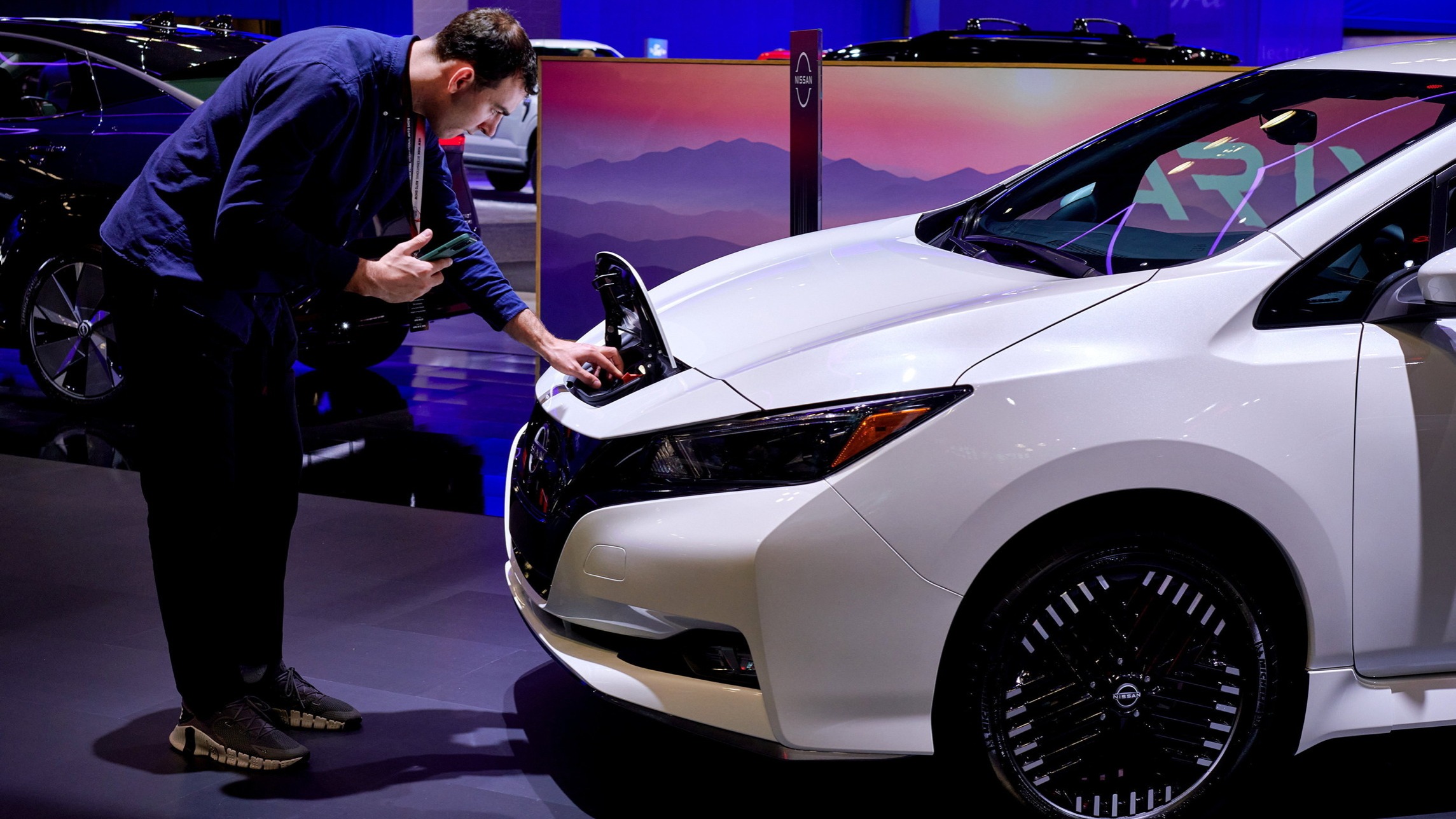 ‘It’s a mess’: carmakers face weeks of uncertainty over EV subsidy scheme