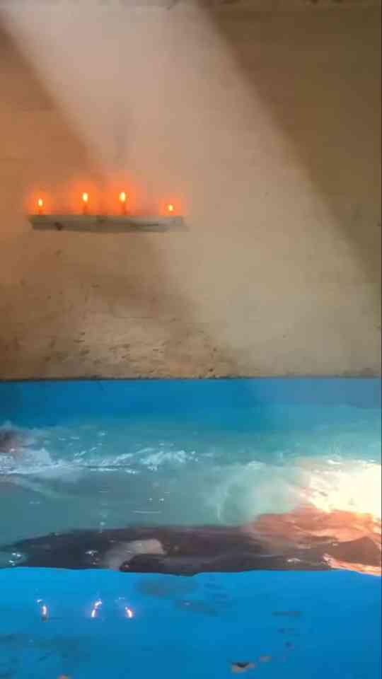 Swimming in a Candlelit Cave Pool: Pure Relaxation!