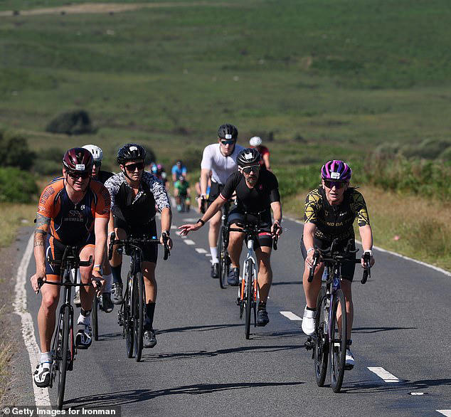 Athlete dies after 'getting into difficulty' while competing in Swansea ...