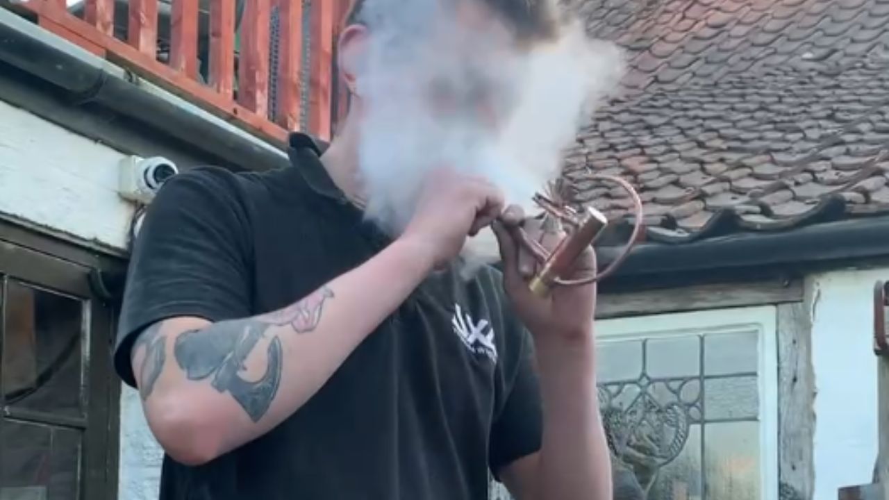 Boy tries a breathalyzer but ends up with powder on his face