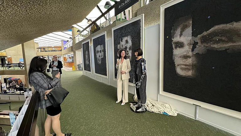 Robot artist Ai-Da unveils portrait of King Charles III at the United ...