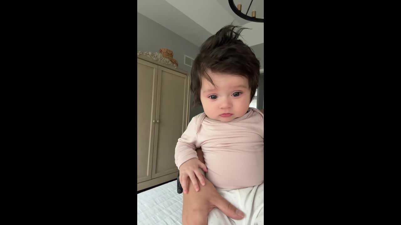Baby tears up unexpectedly while being held in Douglasville, Georgia, USA