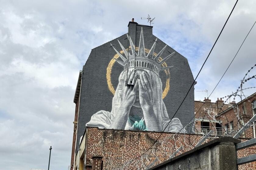 A new mural in France shows the Statue of Liberty covering her eyes in ...