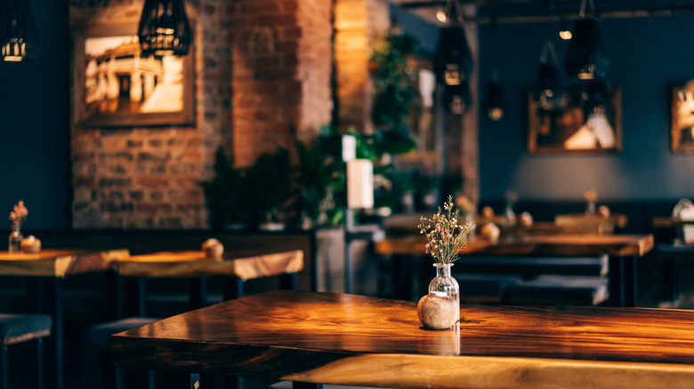 The Sneaky Reason Why Restaurants Keep The Lights Dim