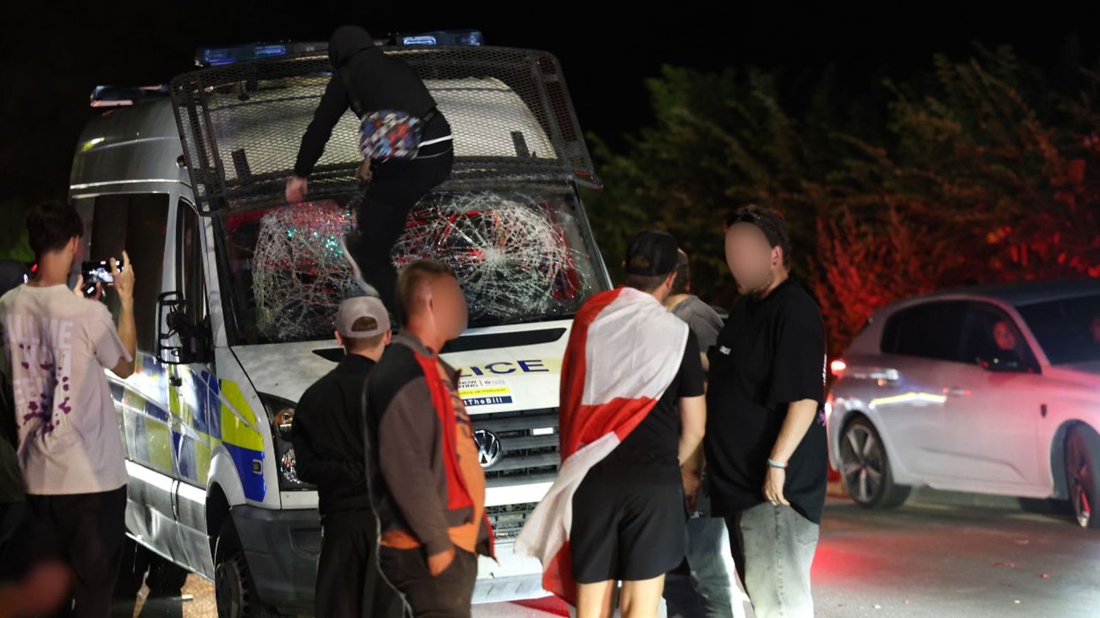 Eight police officers injured in clash with protesters outside alleged ...