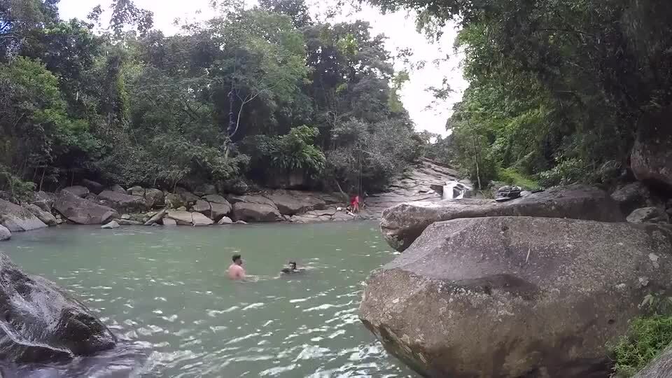 Guy Slips and Hits Butt on Rock During Rope Swing Attempt