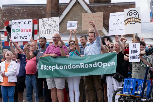 Dozens protest against plans to close level crossing and footbridge option