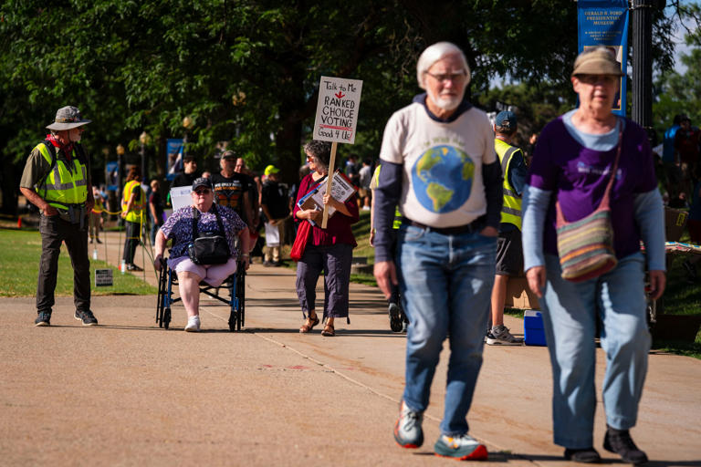 Hundreds rally for ‘Good Trouble’ in Grand Rapids as part of nationwide ...