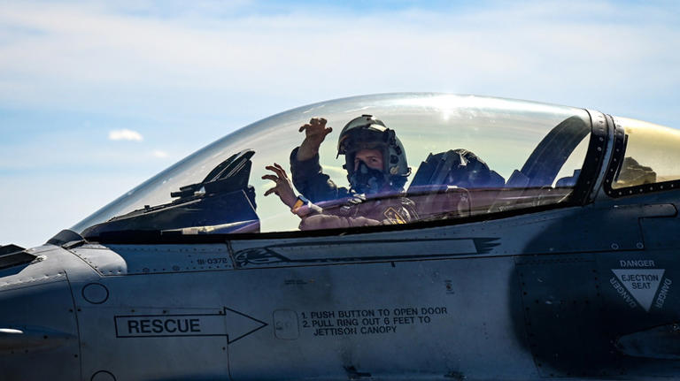 Why Do Fighter Pilots Give The 'Claw' Hand Signal? Here's What It Means