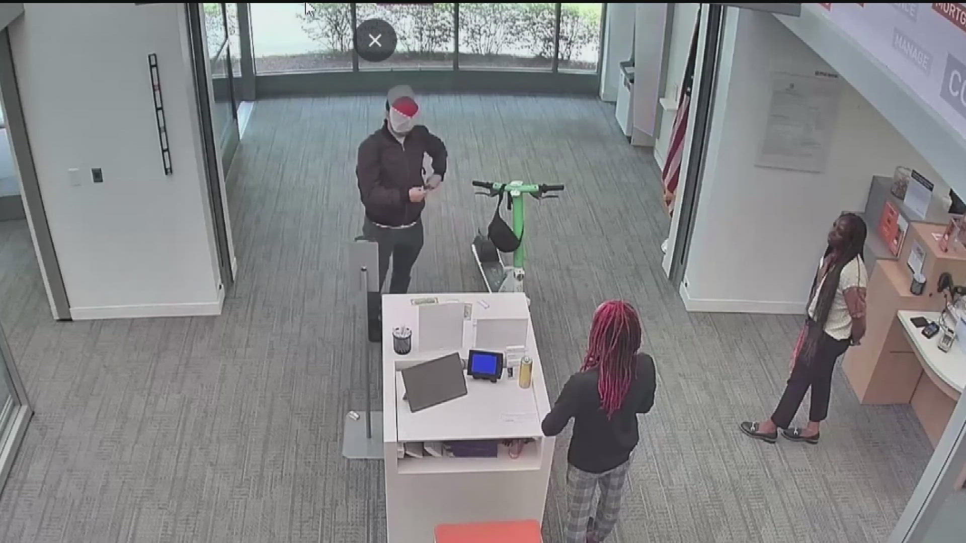 New video shows man allegedly robbing bank on scooter