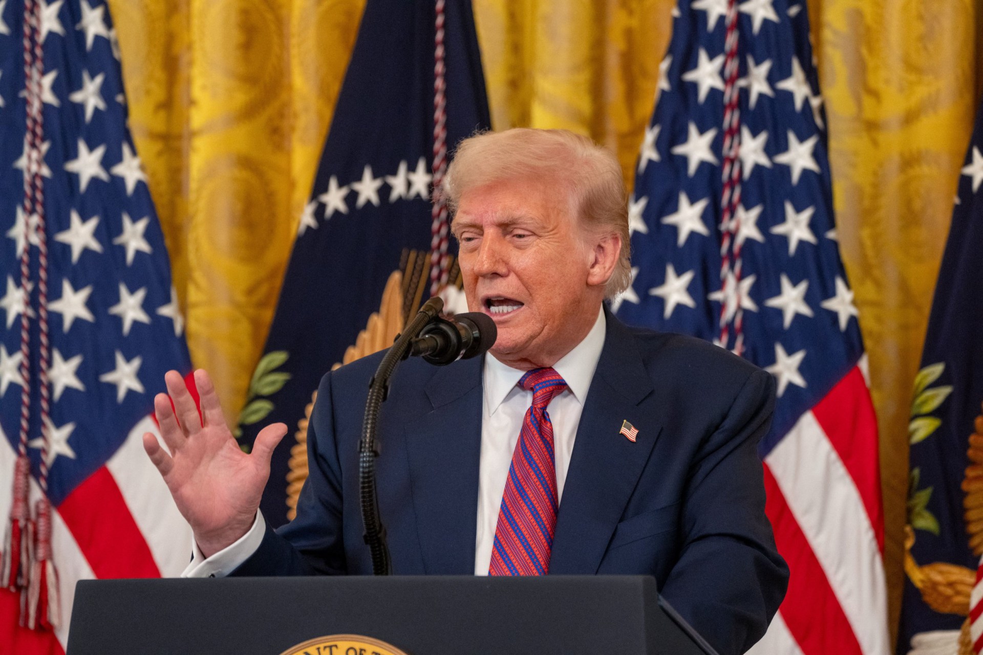 Trump ignores Epstein questions at Genius Act signing
