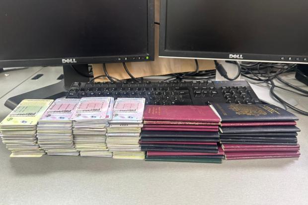 Photo shows staggering number of fake IDs seized by police in ...