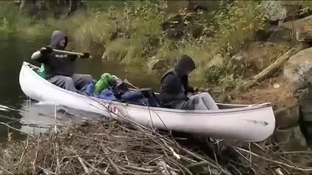 Friends Almost Capsize Canoe over Dam