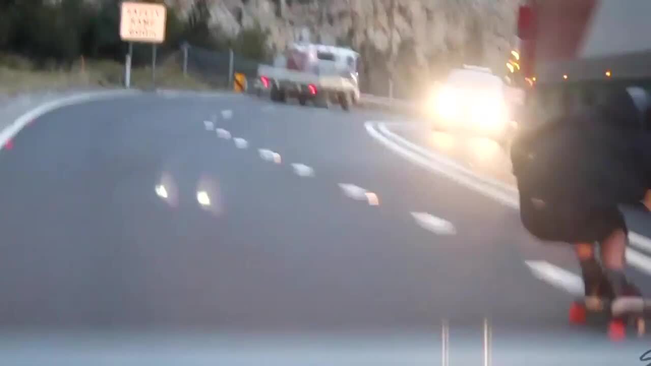 Skateboarding Down Mountain Pass