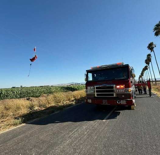 Skydiver rescued after being entangled in Tracy power lines, causing outage