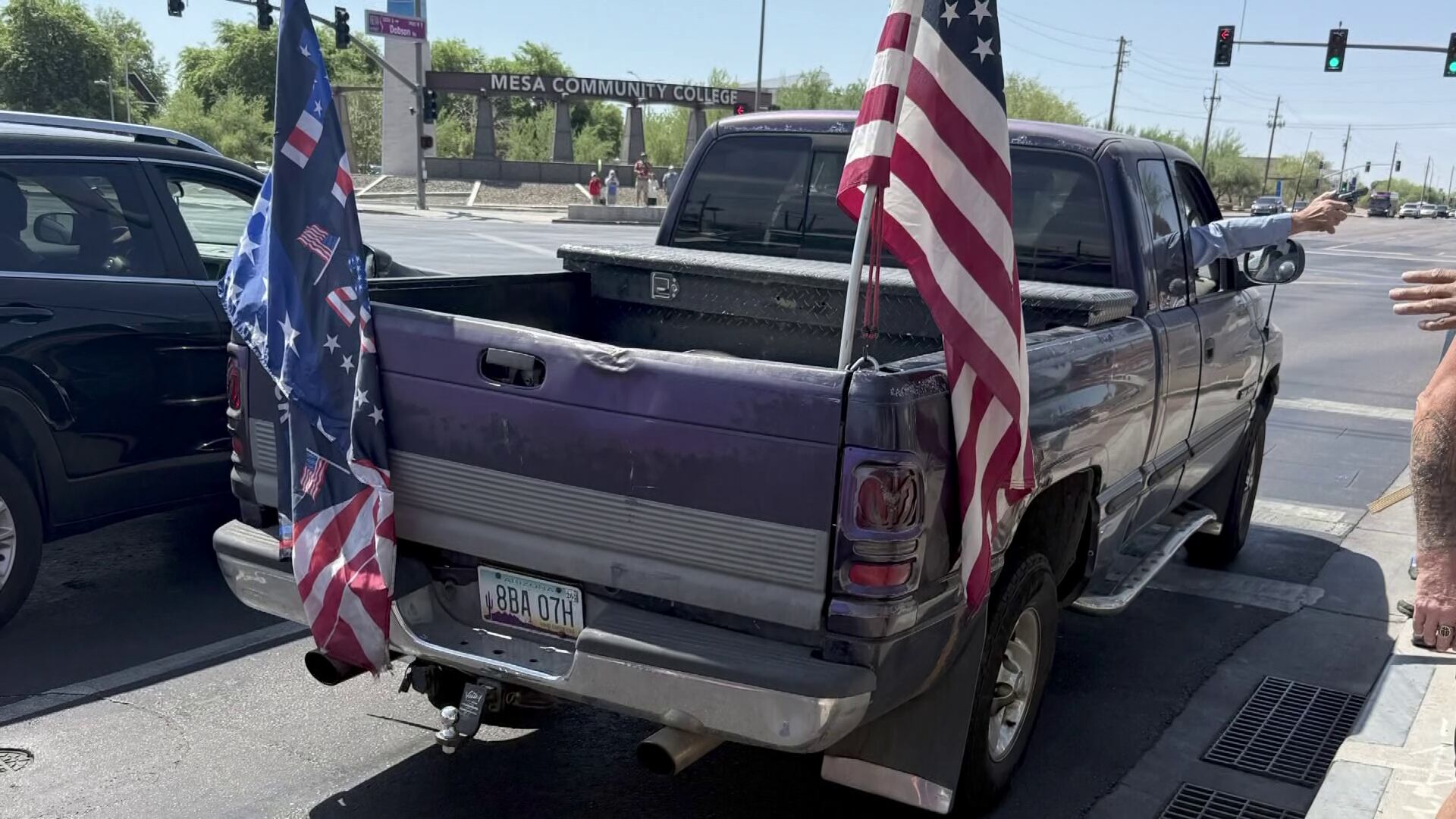 Protestor captures moment man allegedly points gun at Mesa crowd