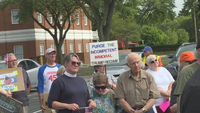 Prayer Action Day protesters gather peacefully outside Rudy Yakym's office