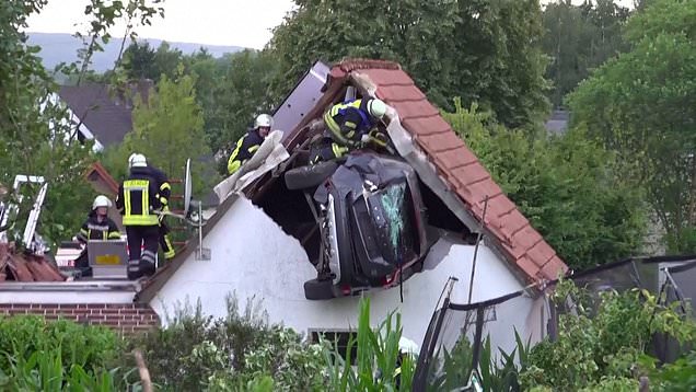 Car stuck in barn roof after crash sends it flying through air