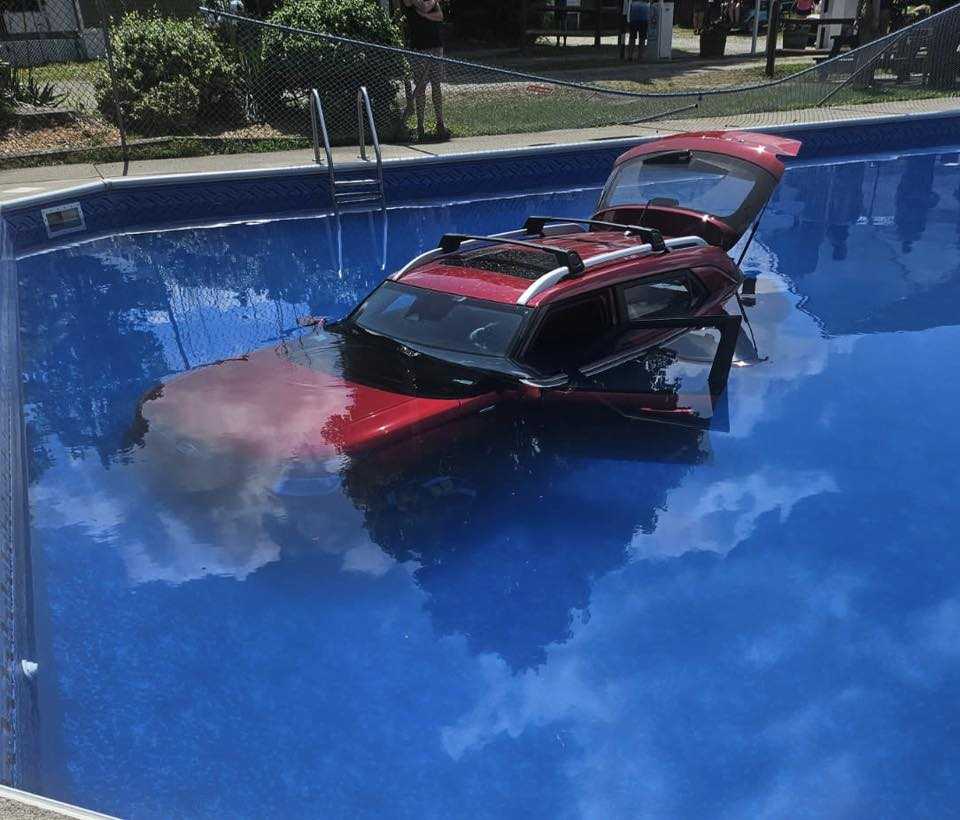 WATCH: Car crashes into summer camp pool, narrowly missing swimmers