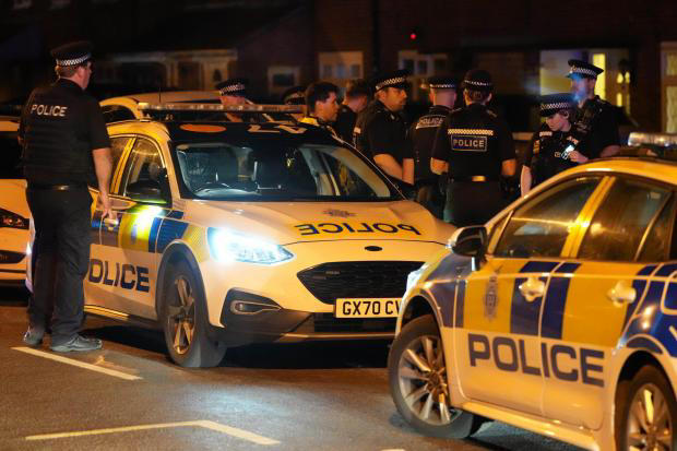 Heavy police presence on street as public warned to 'stay away'