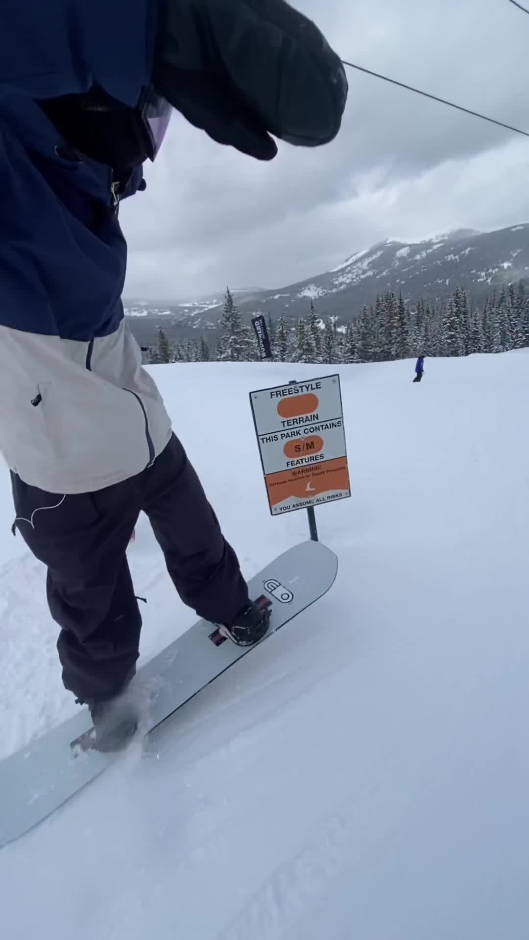 Epic Snowboarding Tricks on a Scenic Mountain Slope