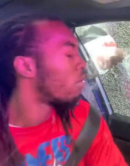 Police officer smashes window and punches driver
