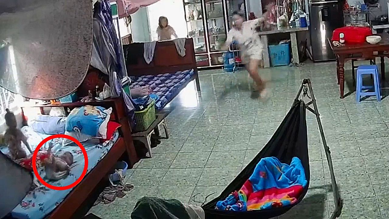 Mom sprints and dives across room to stop baby from falling off bed