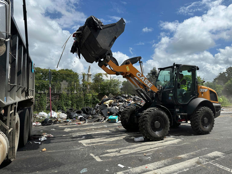 Sanitation workers remain on strike with mounds of trash piling up in ...
