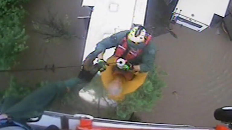 Moment two people rescued from motorhome roof in Texas flash floods
